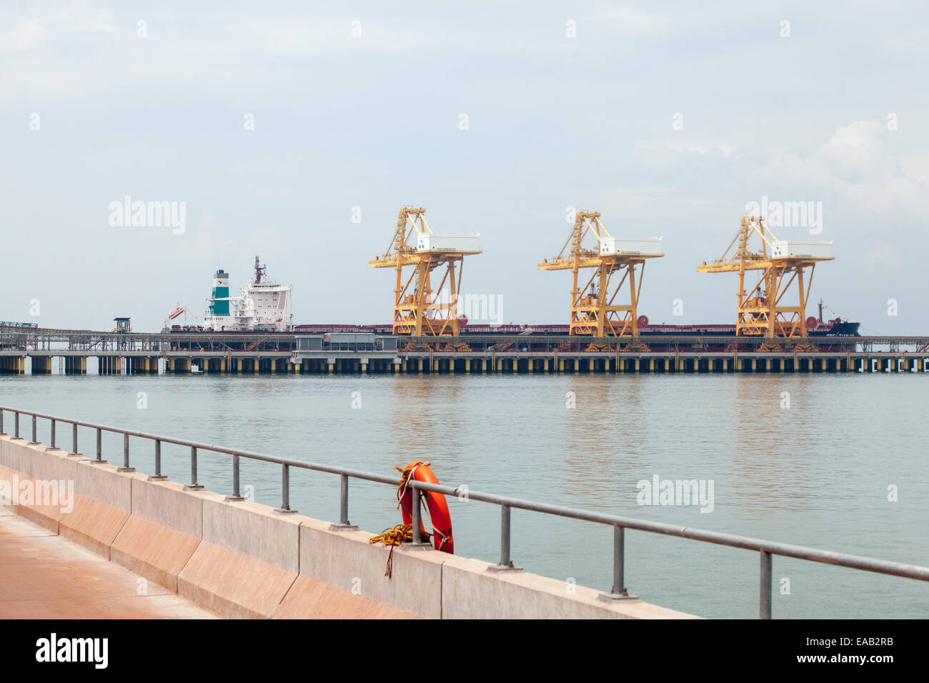 A bulk carrier ship sits berthed next to ship loaders at the pier Vale ...