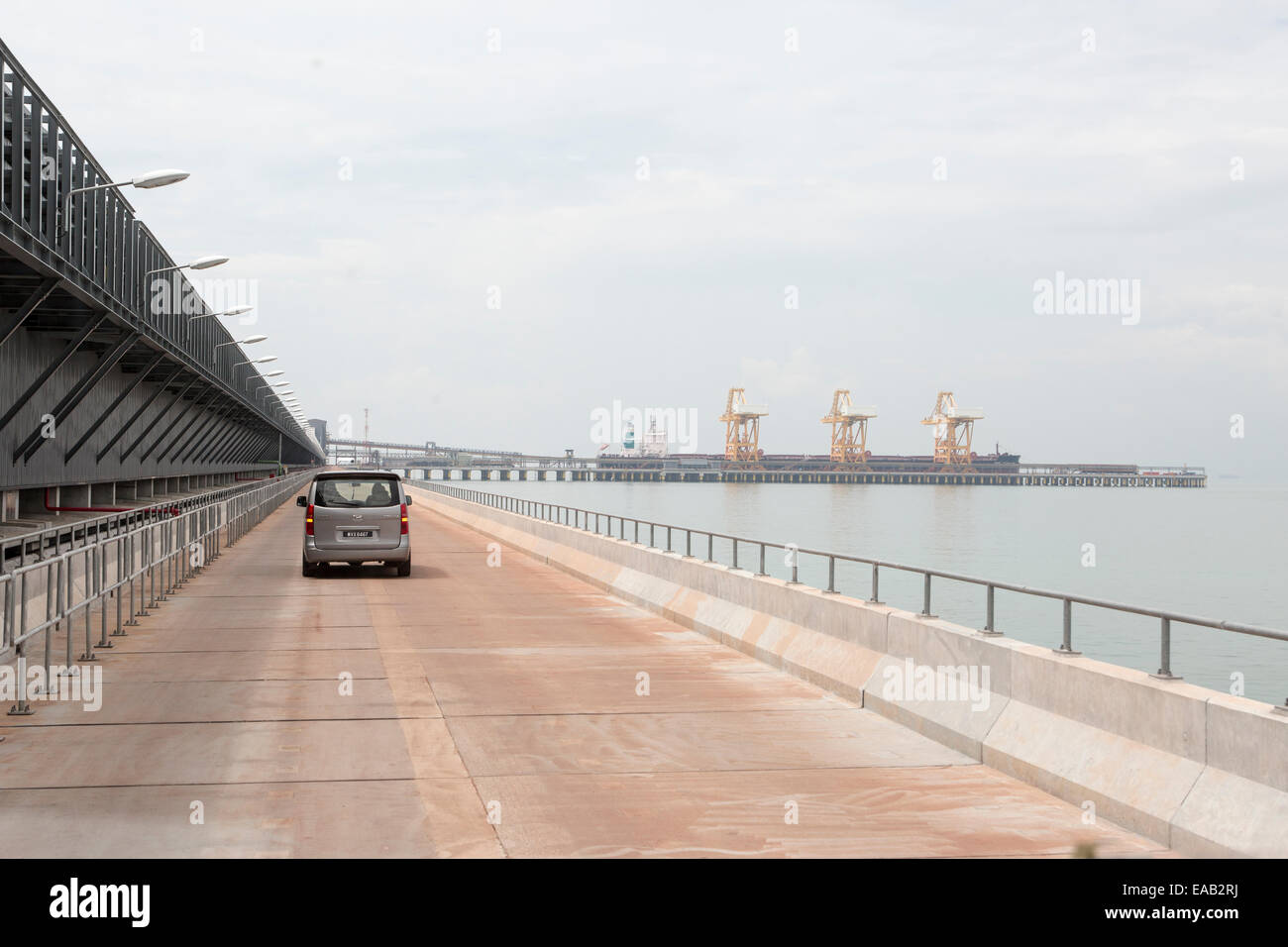 A bulk carrier ship sits berthed next to ship loaders at the pier Vale ...