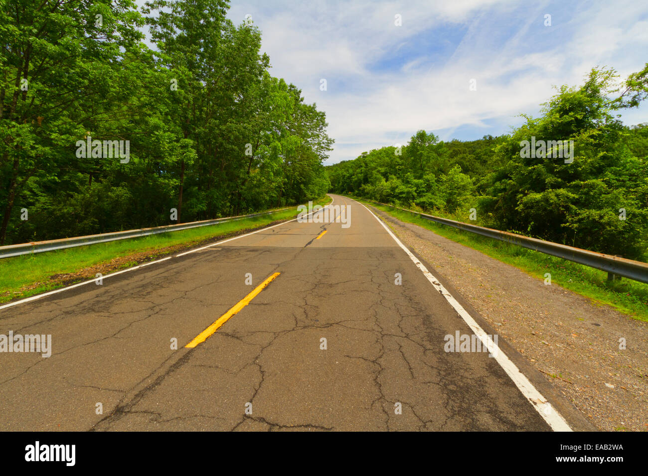 General view of a paved road .in the countryside Stock Photo - Alamy