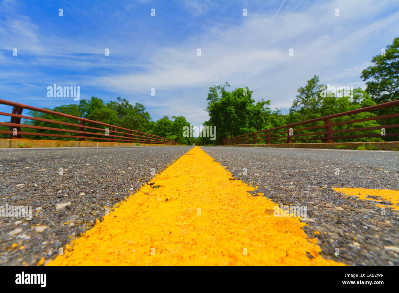 General view of a paved road .in the countryside Stock Photo - Alamy