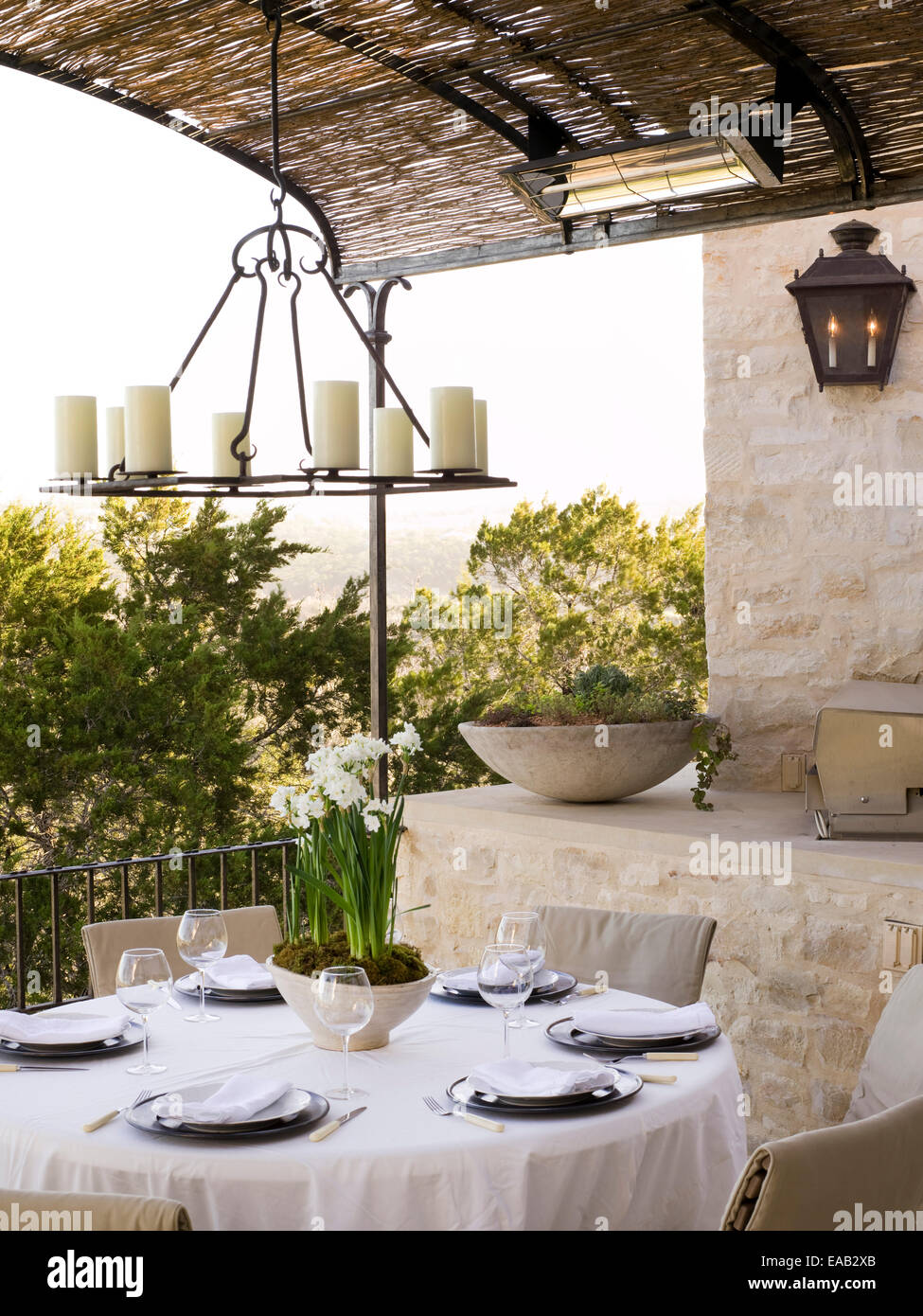 set table on outdoor stone patio Stock Photo - Alamy