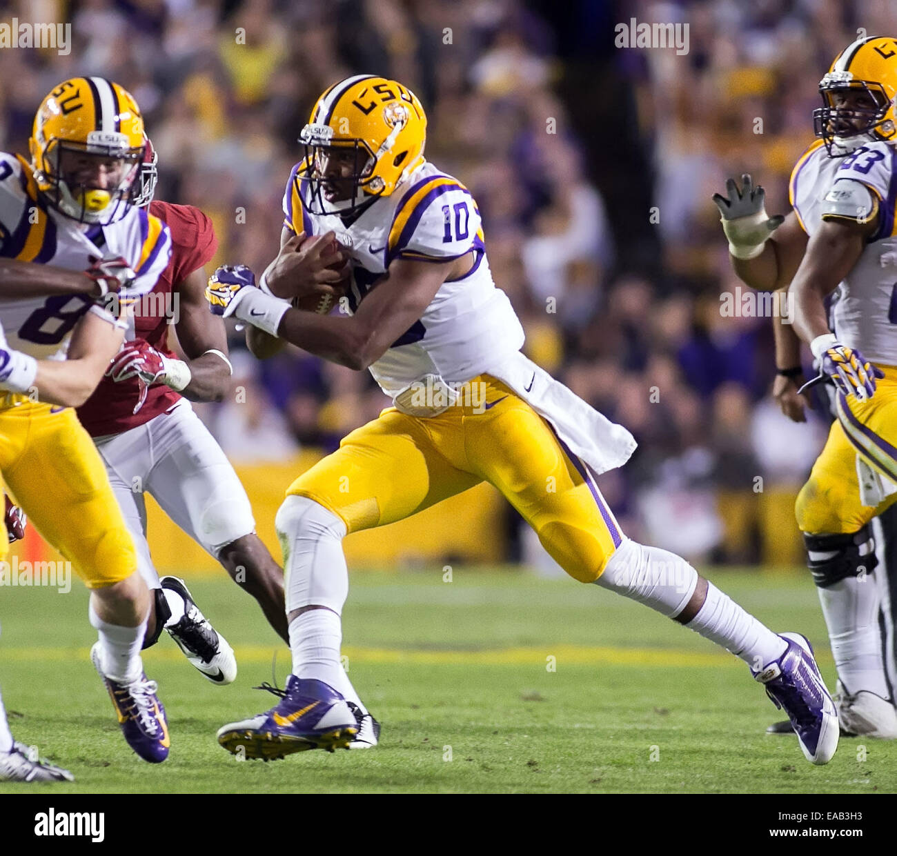LSU Tigers quarterback Anthony Jennings (10) breaks free to make a pass ...