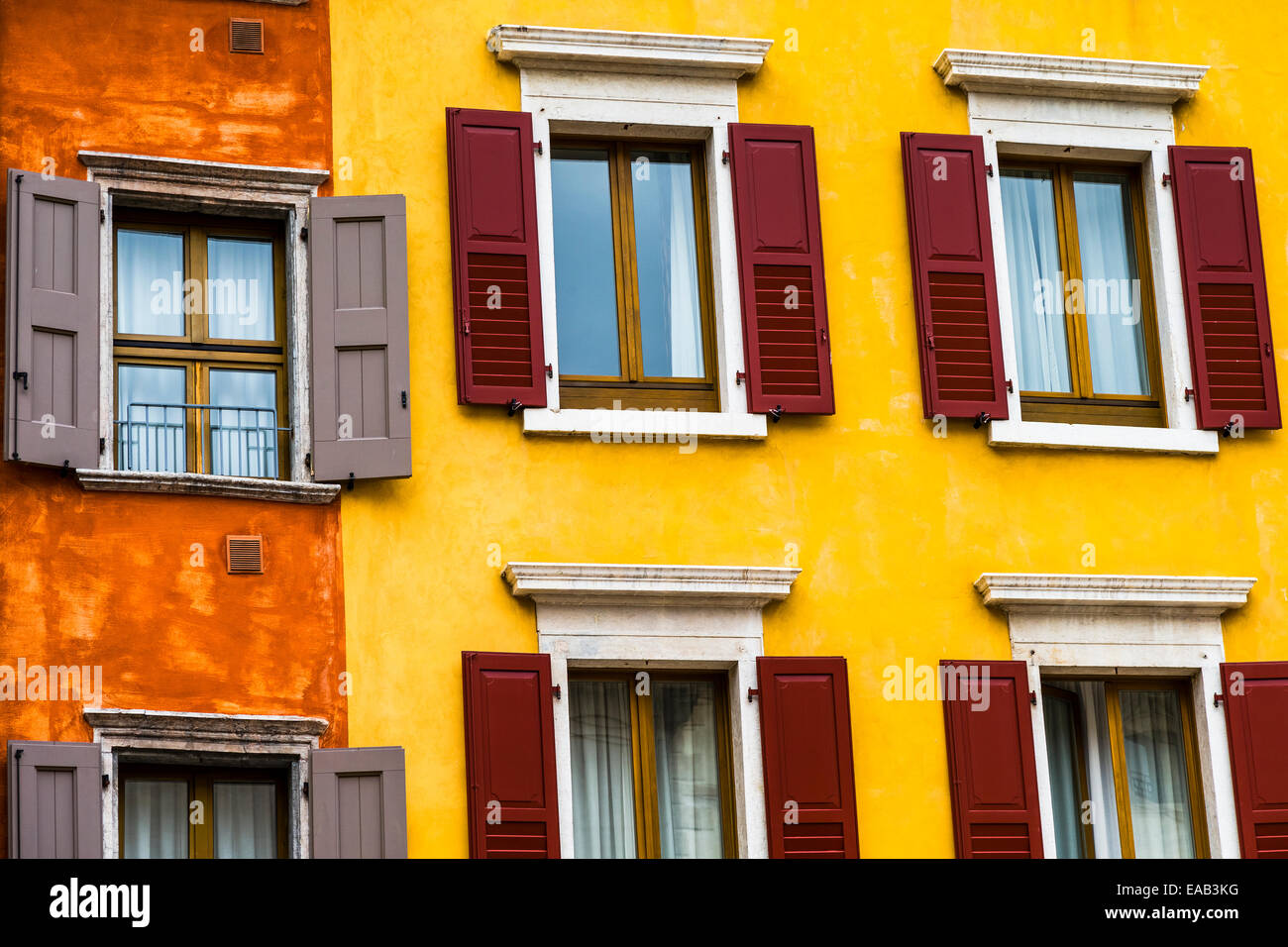 Shuttered windows on a colourful building in old town Riva Del Garda ...