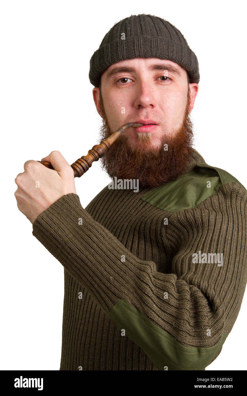 young bearded guy smoking a pipe on a light background Stock Photo - Alamy