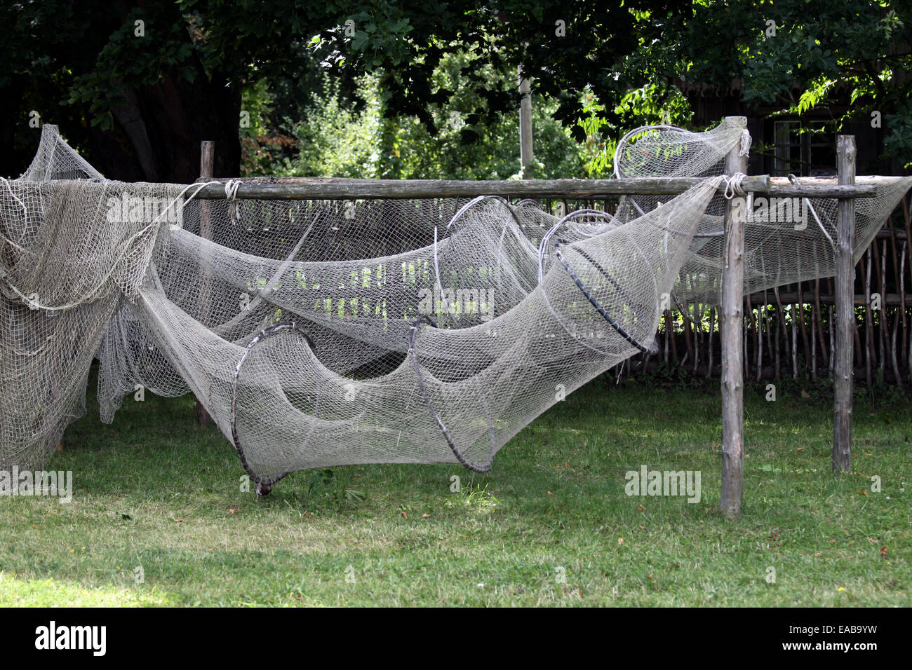 Fishing net hanging and drying in natural rural environment Stock Photo ...