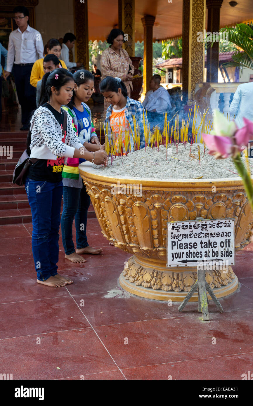 Cambodia, Siem Reap. Young Women Worshipers Placing Incense at Preah ...