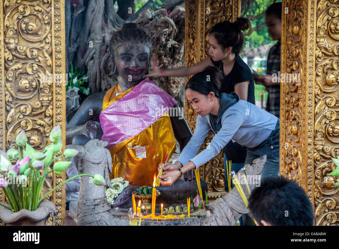 Cambodia, Siem Reap. Worshipers at Shrine to Ya Tep, a Spirit (Neak-Ta ...