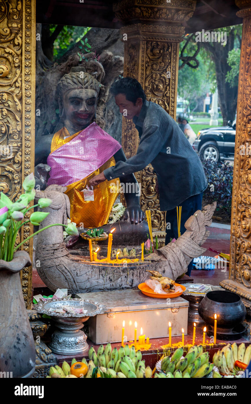Animism neak ta offering shrine spirit spirit worship temple worshiper ...