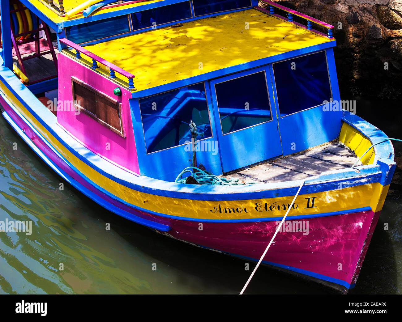 Colorful Boat Docked Stock Photo - Alamy