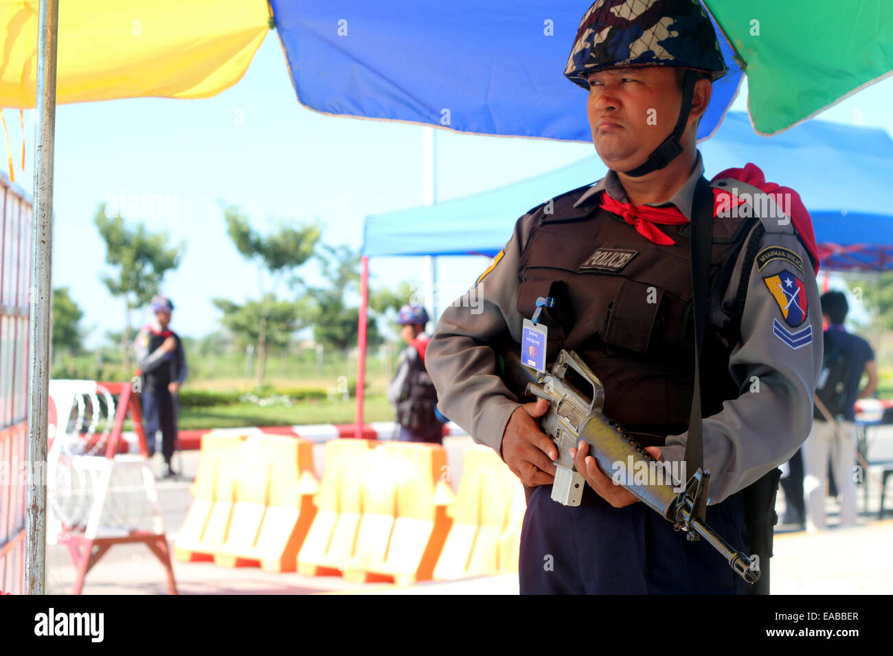 Nay Pyi Taw, Myanmar. 11th Nov, 2014. Myanmar policemen stand guard at ...