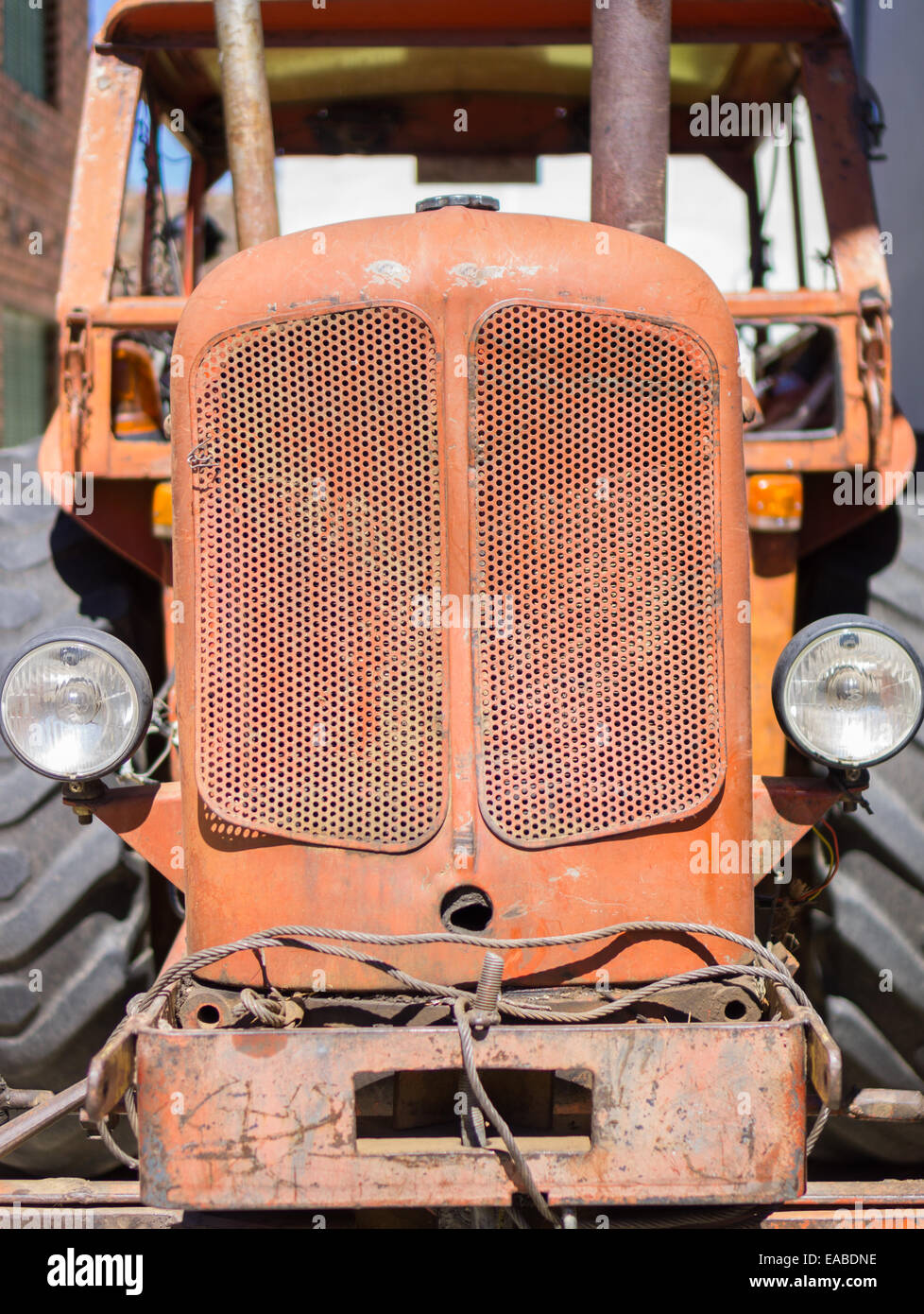 Front view of old red tractor and cab Stock Photo - Alamy