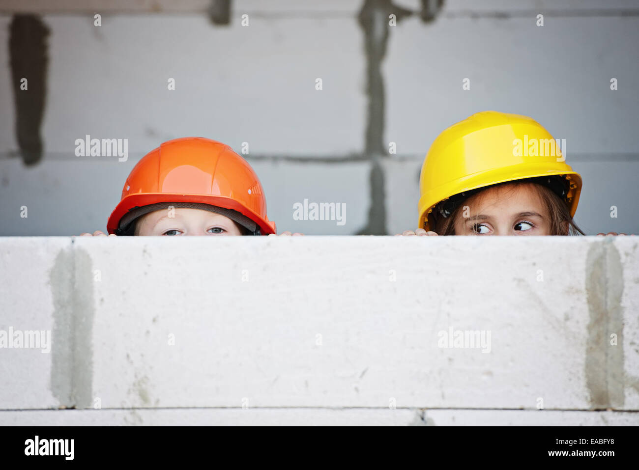 boy and girl playing on construction site Stock Photo - Alamy