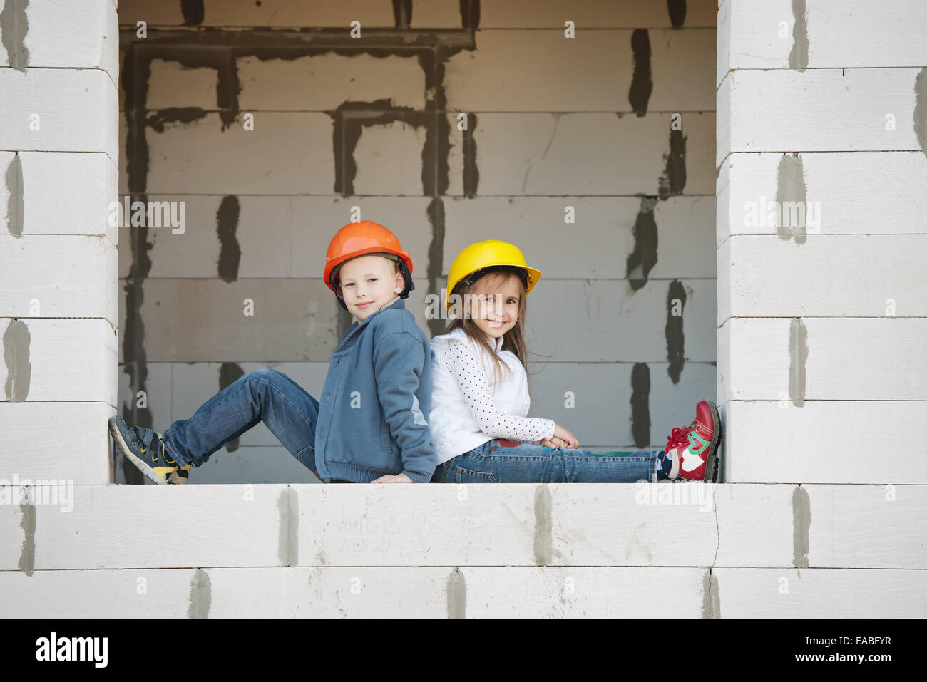 boy and girl playing on construction site Stock Photo - Alamy