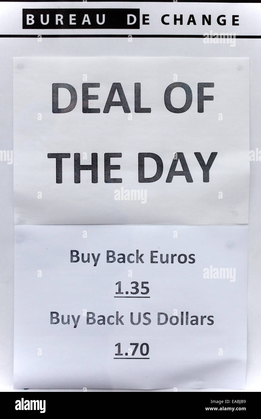 Currency exchange shop with adverts offering the days deals and ...