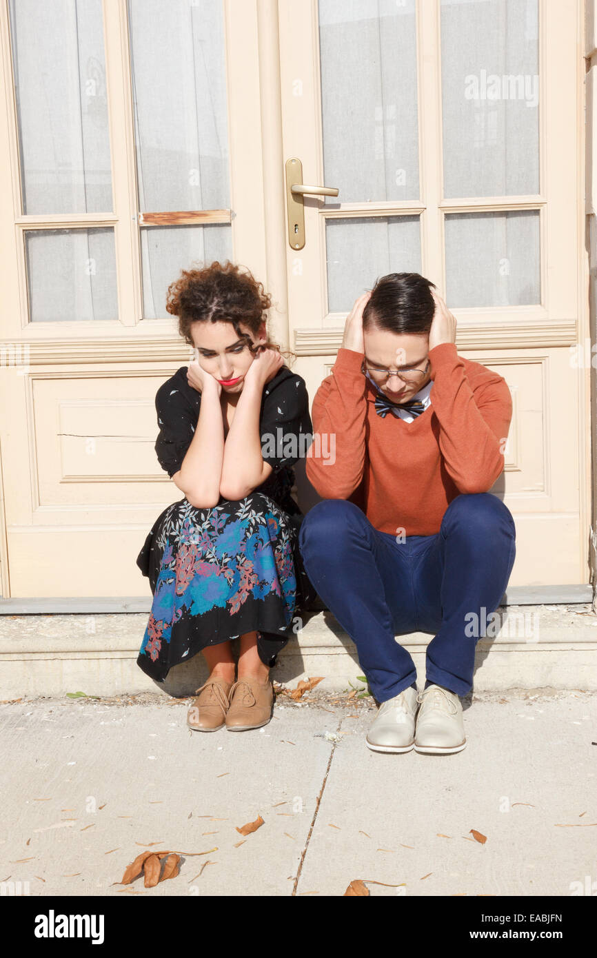 Couple sad outside house hi-res stock photography and images - Alamy
