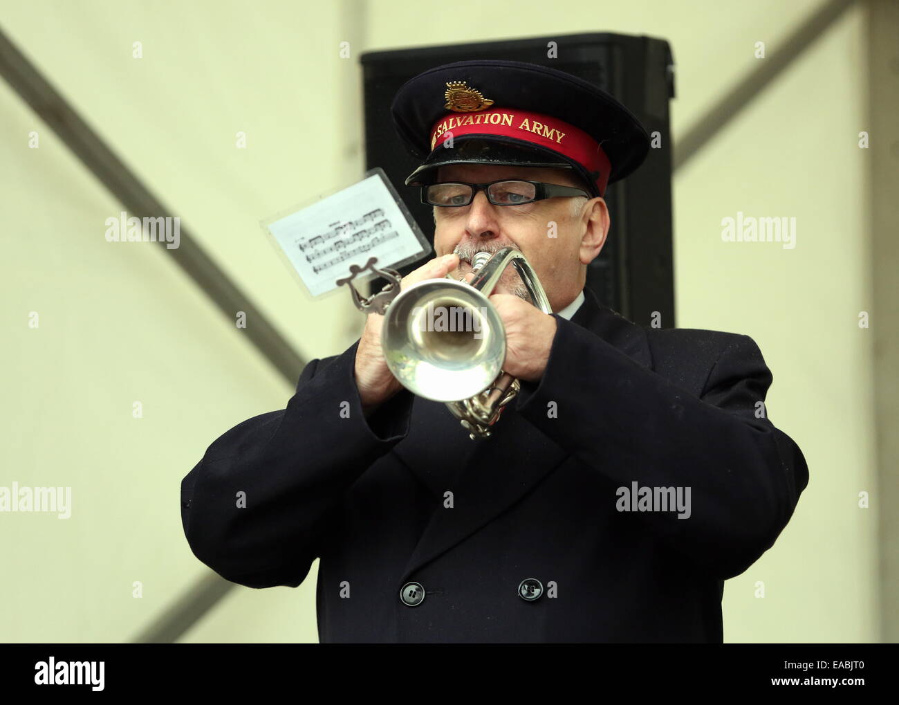 Swansea UK. Tuesday 11 November 2014 Pictured: A bugler marks the start ...