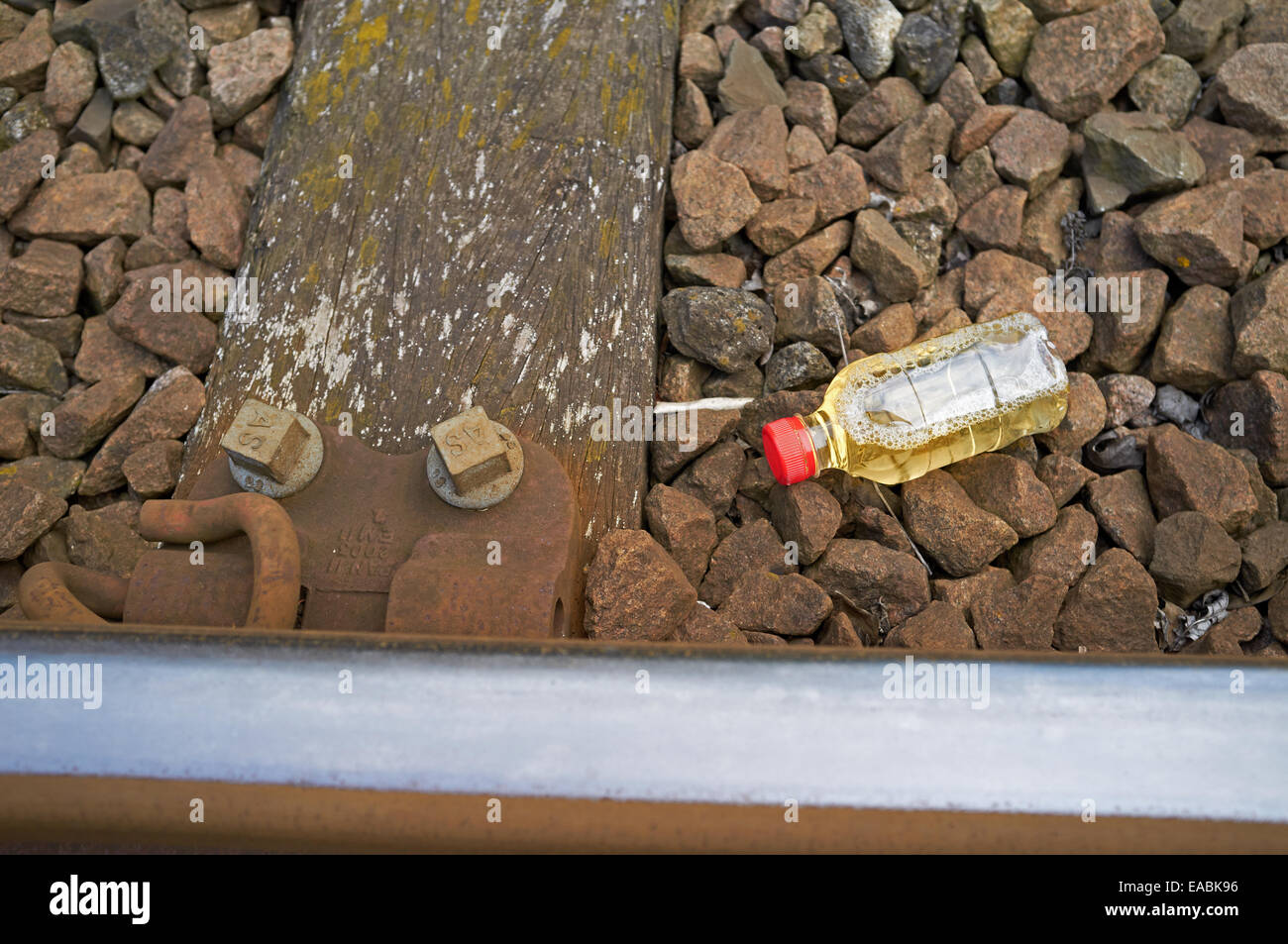 Plastic water bottle filled with urine thrown onto railway track Stock ...