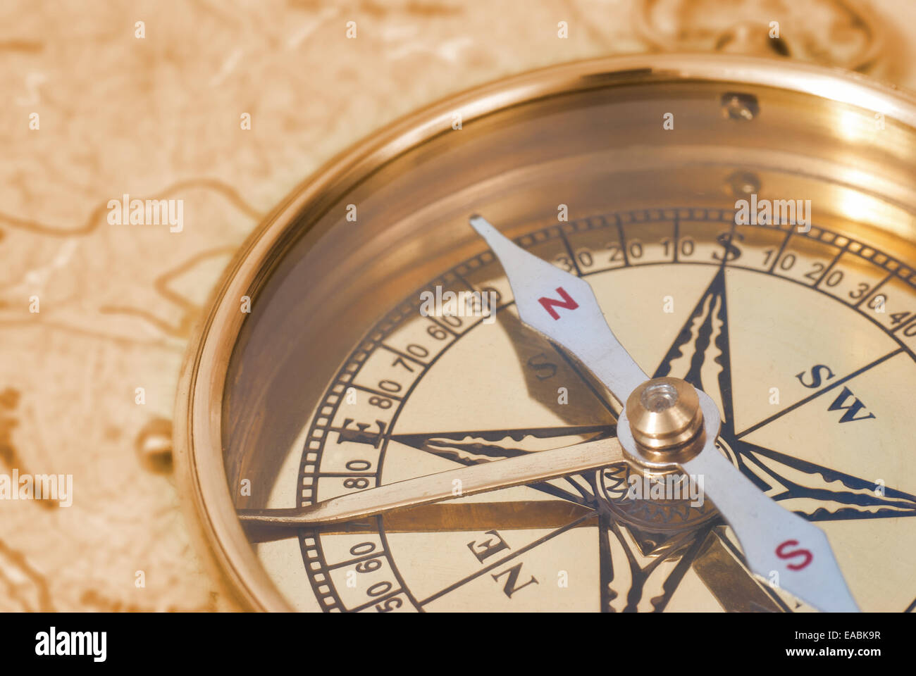 Ancient compass on the grunge old map Stock Photo - Alamy