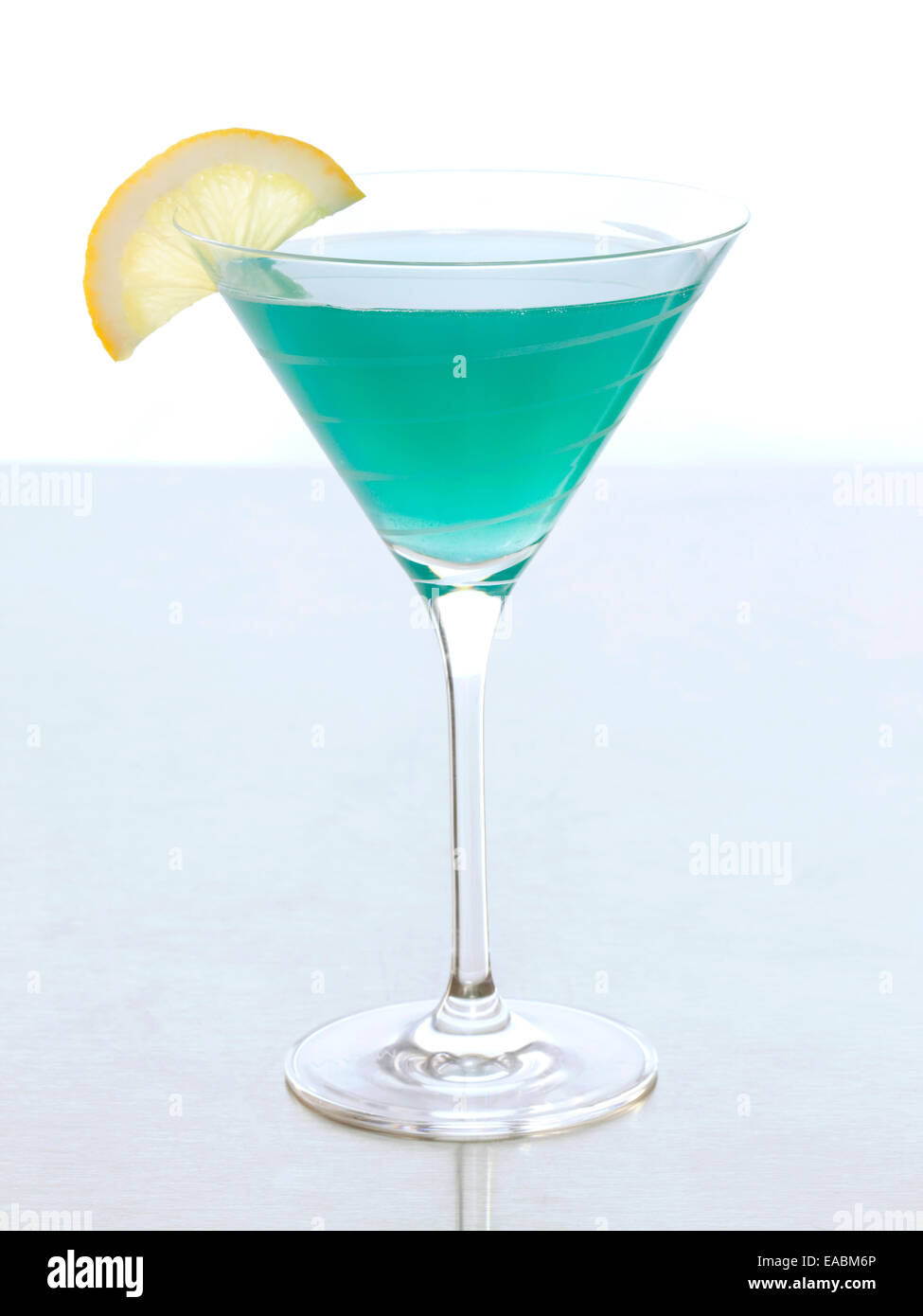 Blue Martini with Lemon Wedge Stock Photo - Alamy