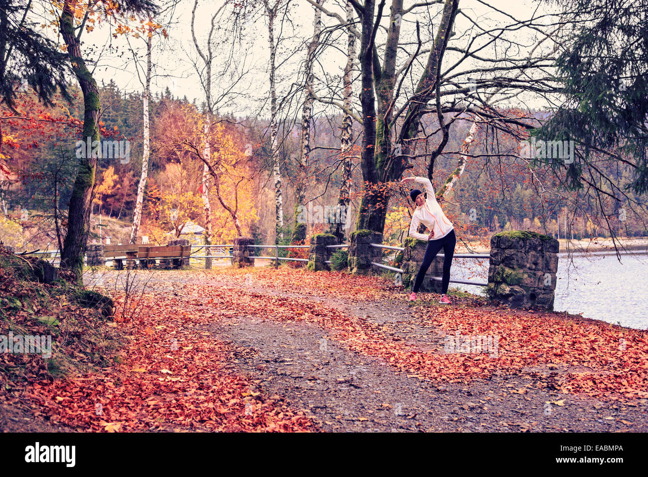 woman running through the forest by the lake Stock Photo - Alamy