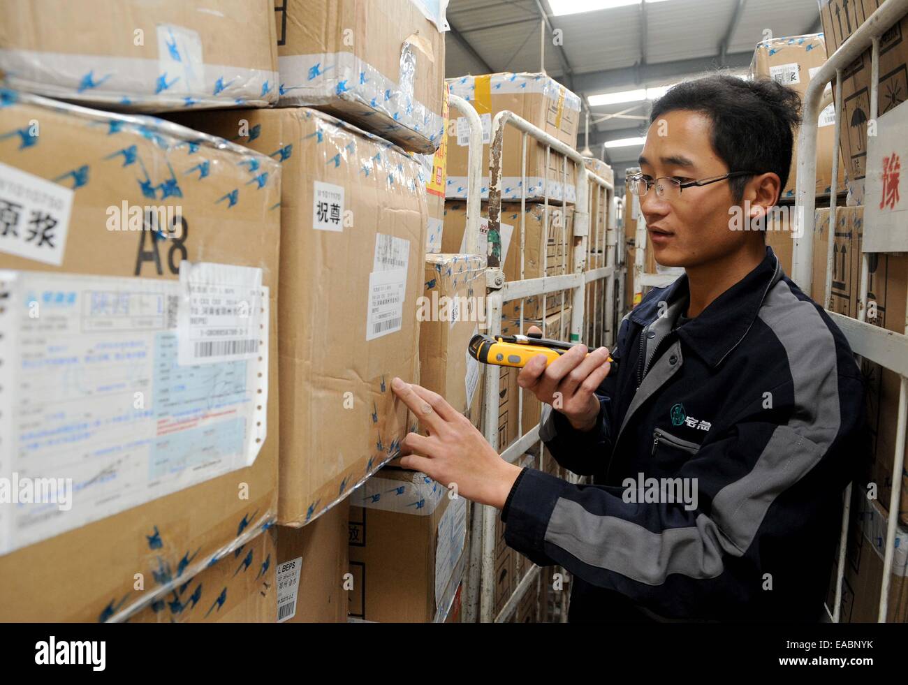 Zhengzhou. 11th Nov, 2014. Staff member work at a sorting center of ZJS ...