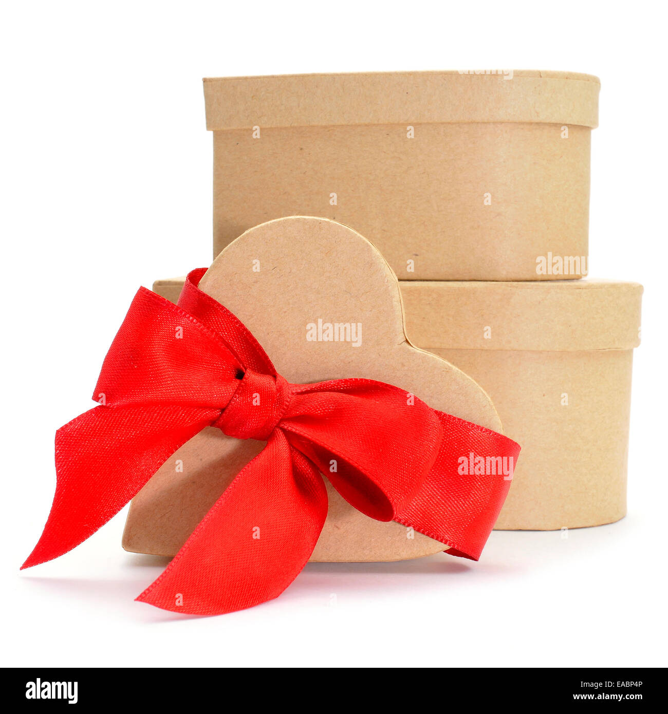 some heart-shaped gift boxes with a red ribbon on a white background ...