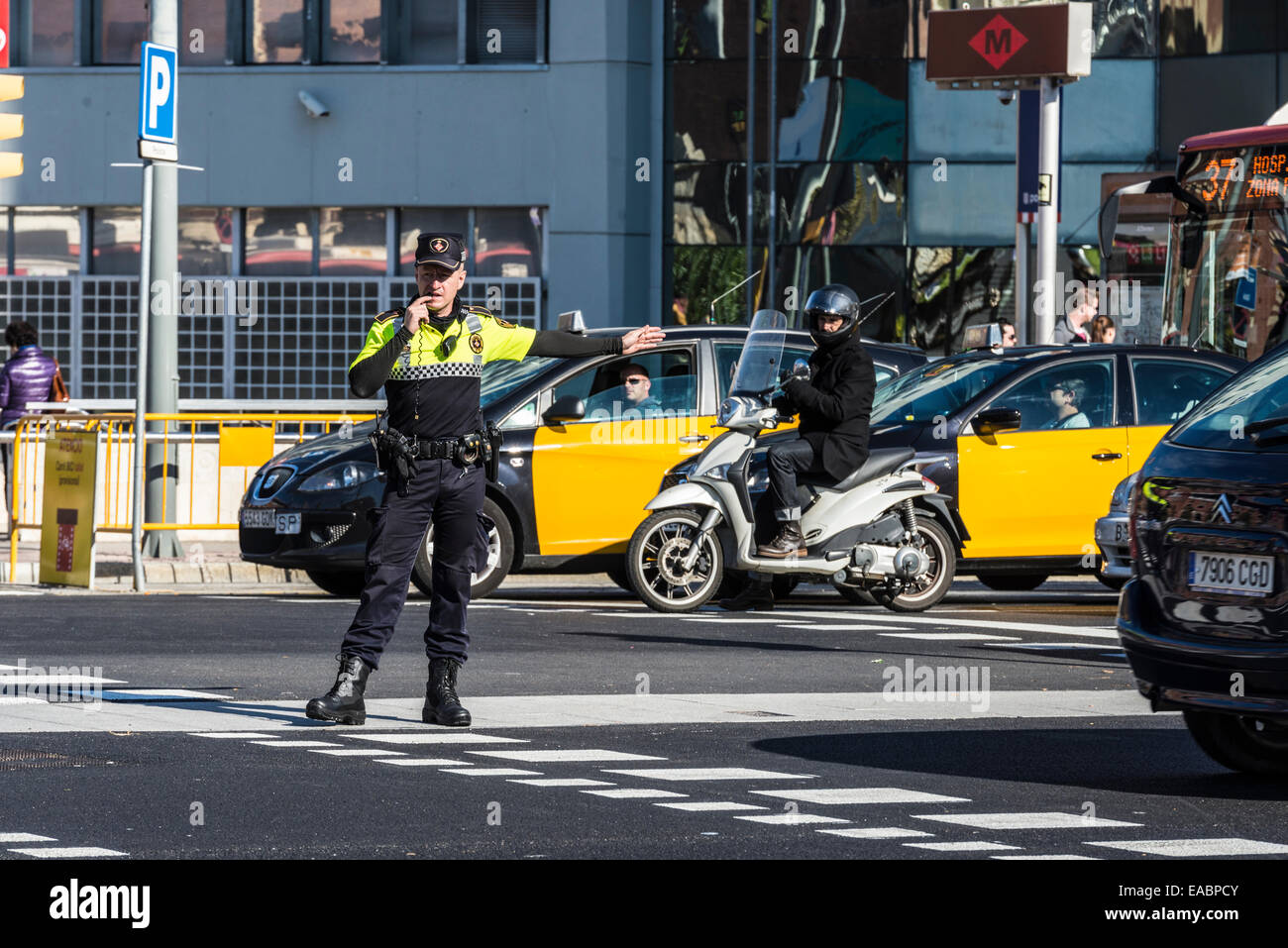 Police directing traffic in a square in Barcelona, Catalonia, Spain ...