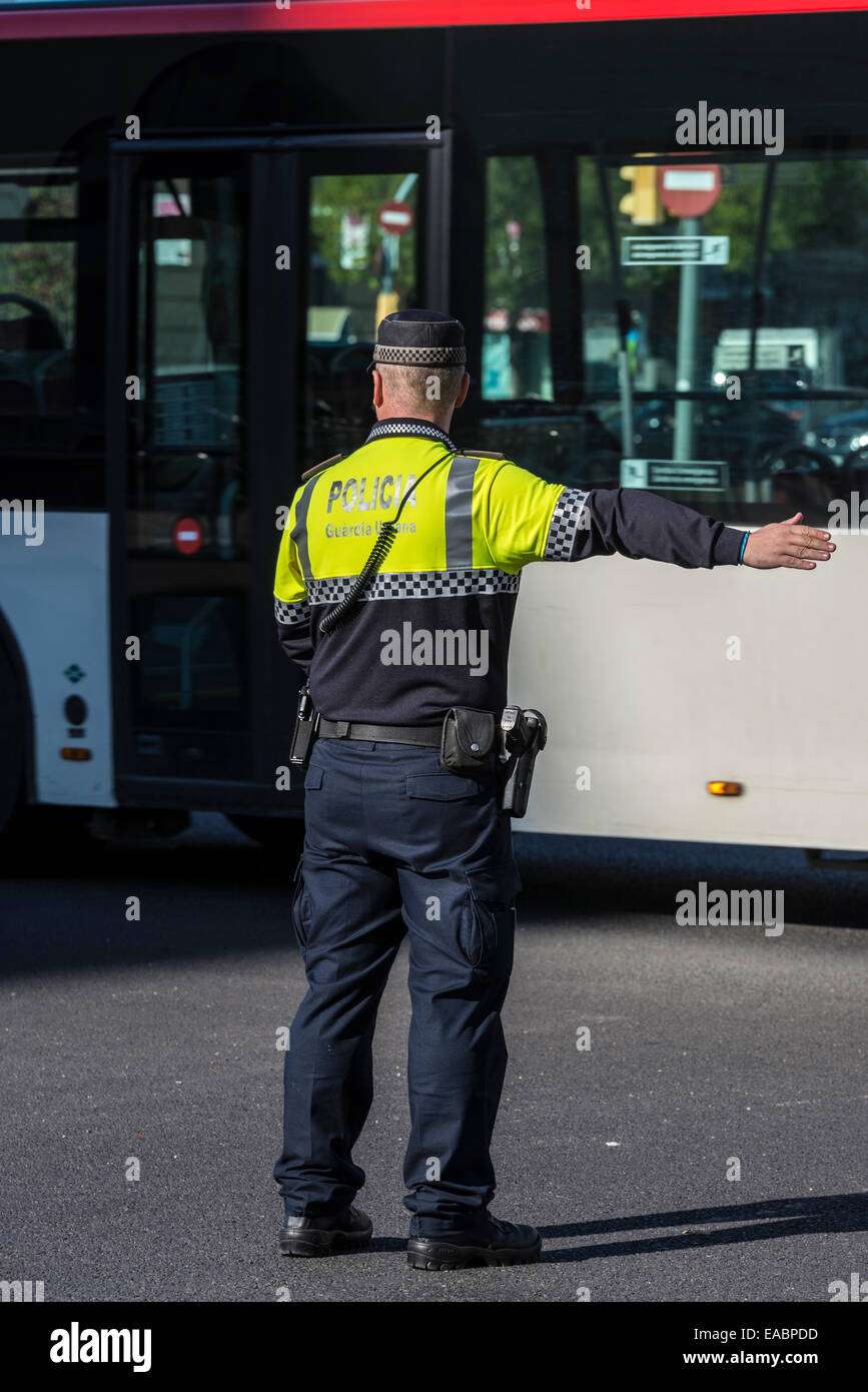 Police directing traffic in a square in Barcelona, Catalonia, Spain ...