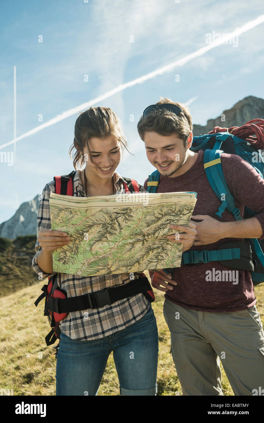 Austria Tyrol Tannheimer Tal young hikers looking at map Stock Photo ...
