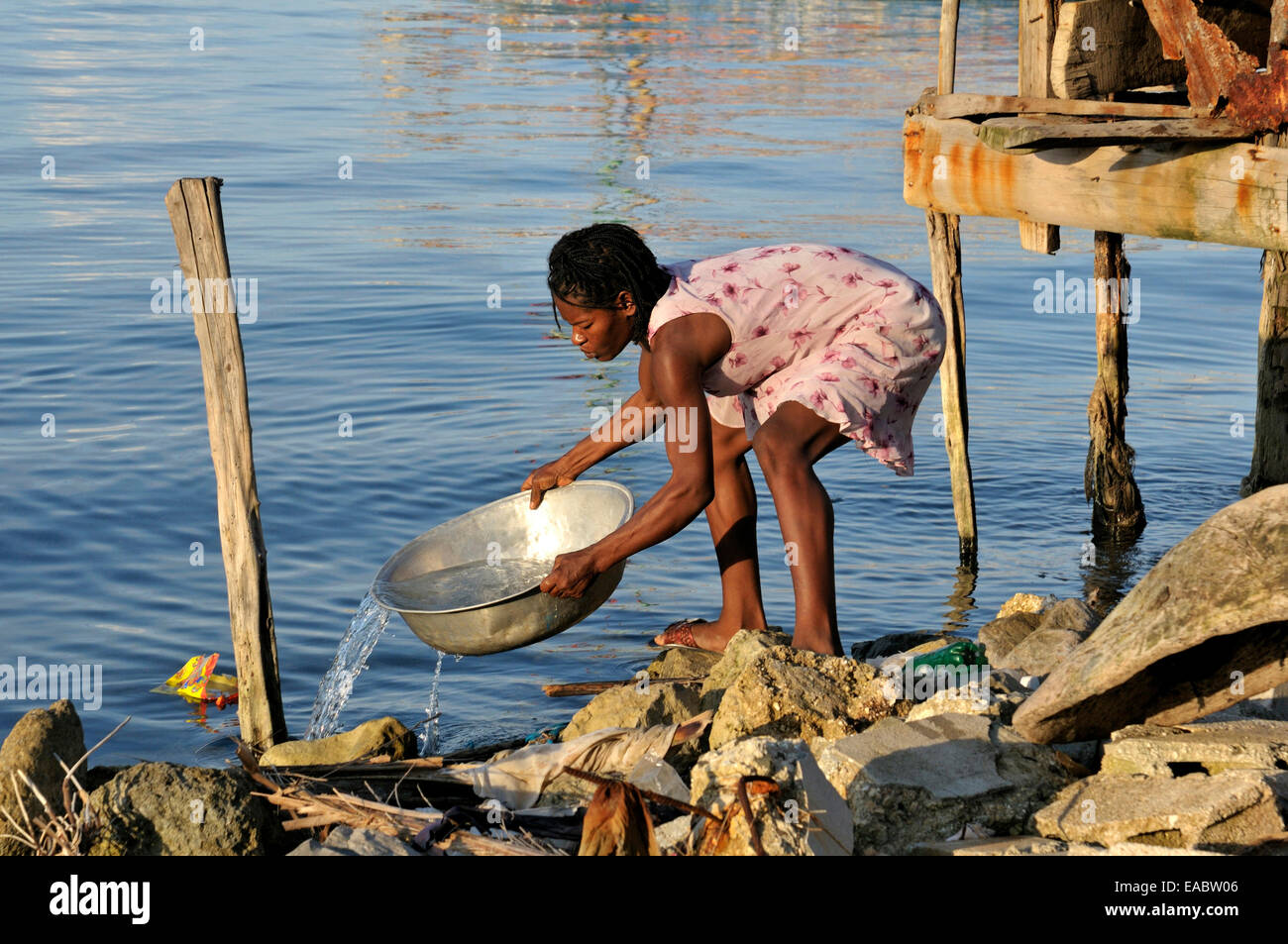 Woman fetching water hi-res stock photography and images - Alamy