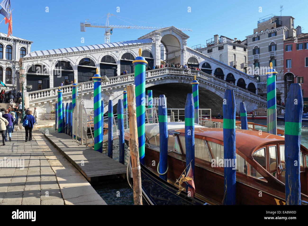 Mooring poles by the Rialto Bridge on the Grand Canal in Venice, Italy ...