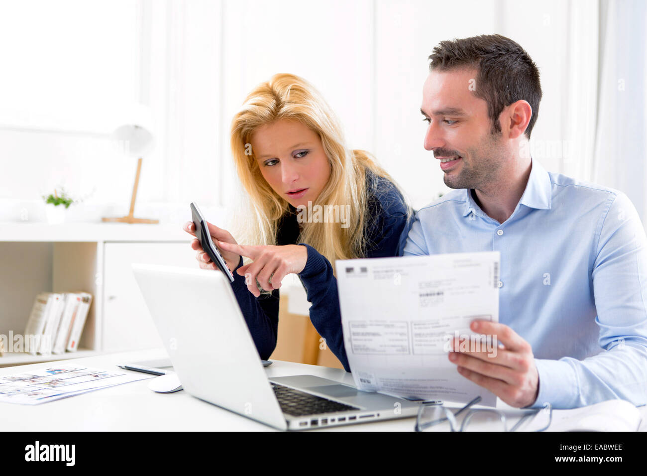 View of an Attractive couple doing administrative paperwork Stock Photo ...