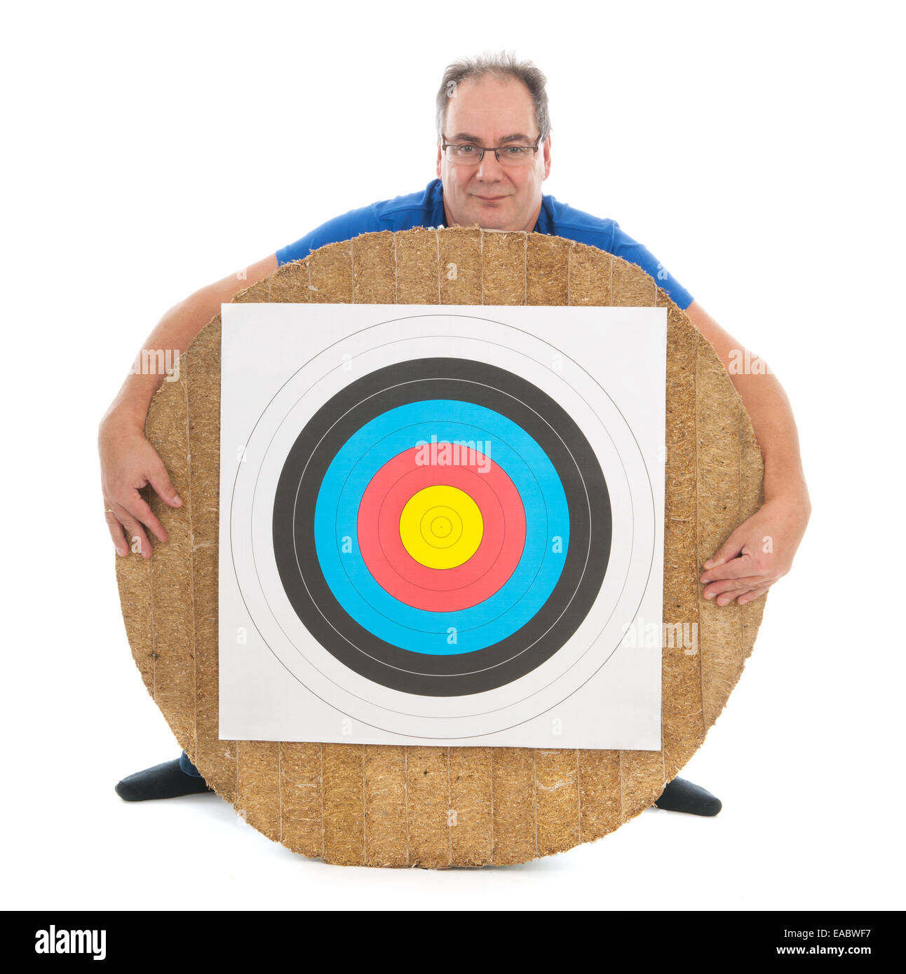 Adult man behind archery target isolated over white background Stock ...