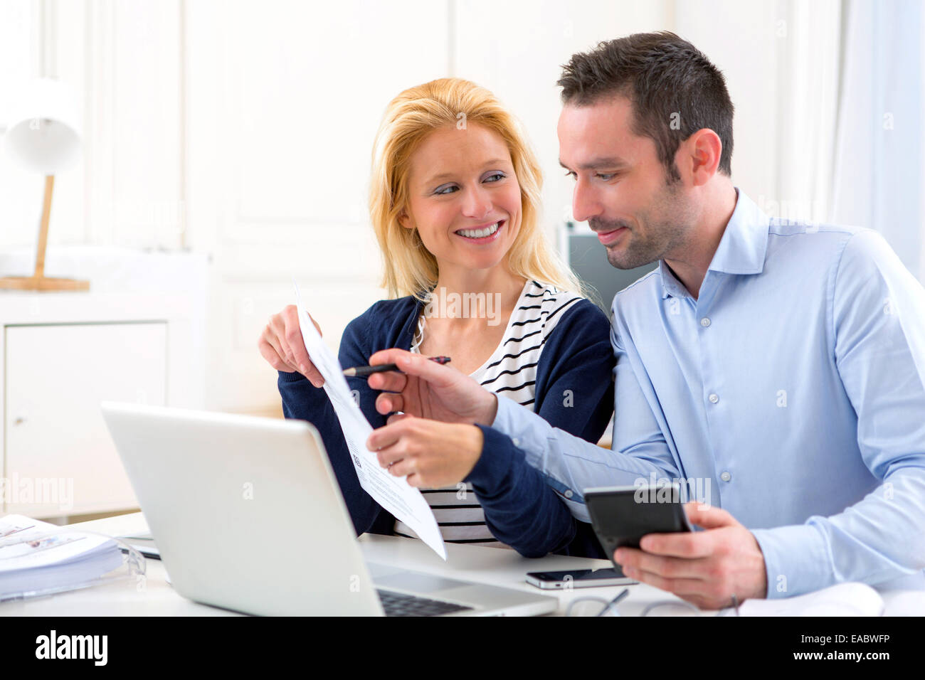 View of an Attractive couple doing administrative paperwork Stock Photo ...