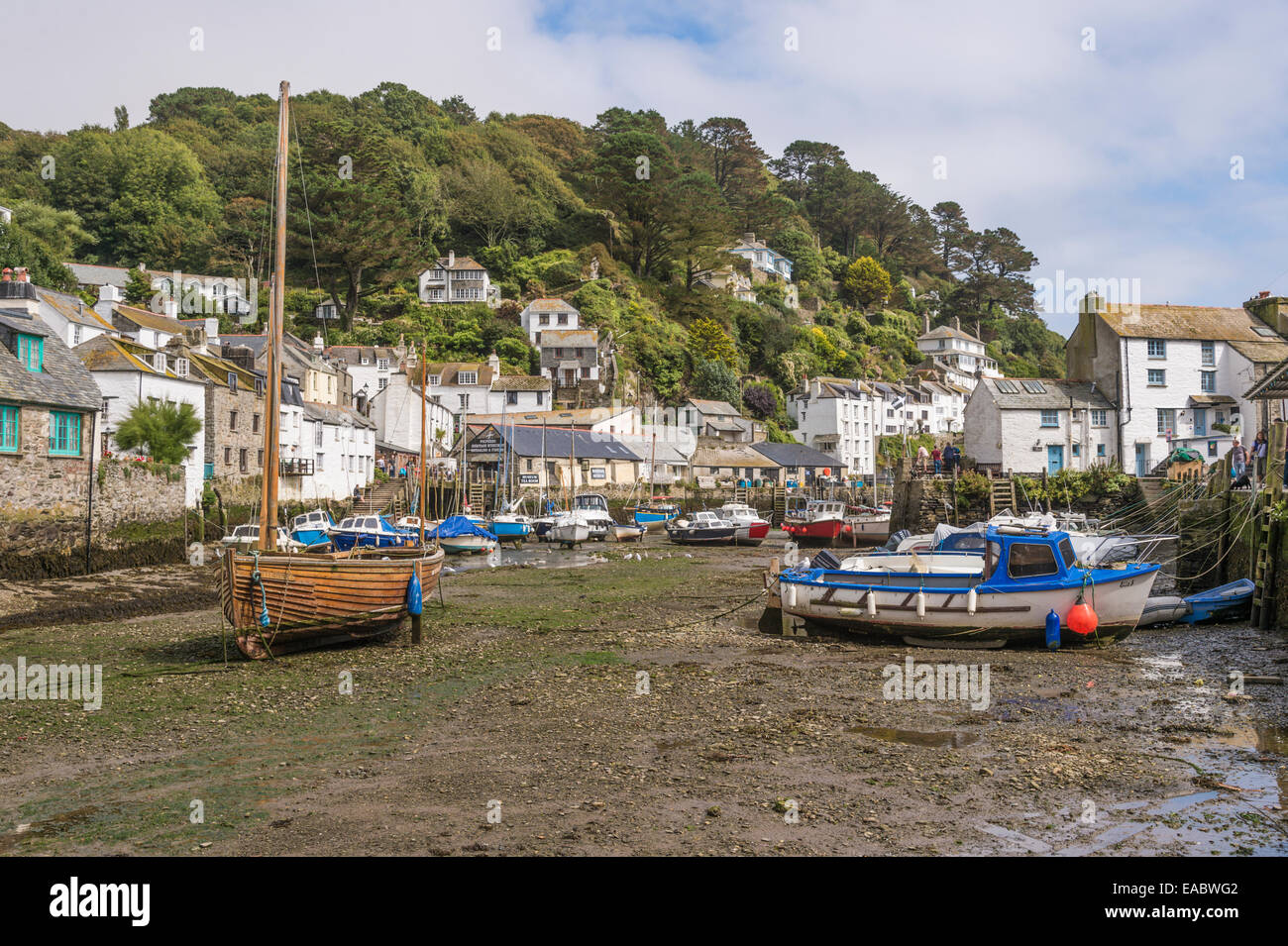UK Cornwall Polperro Boats at fishing harbour during low tide Stock ...