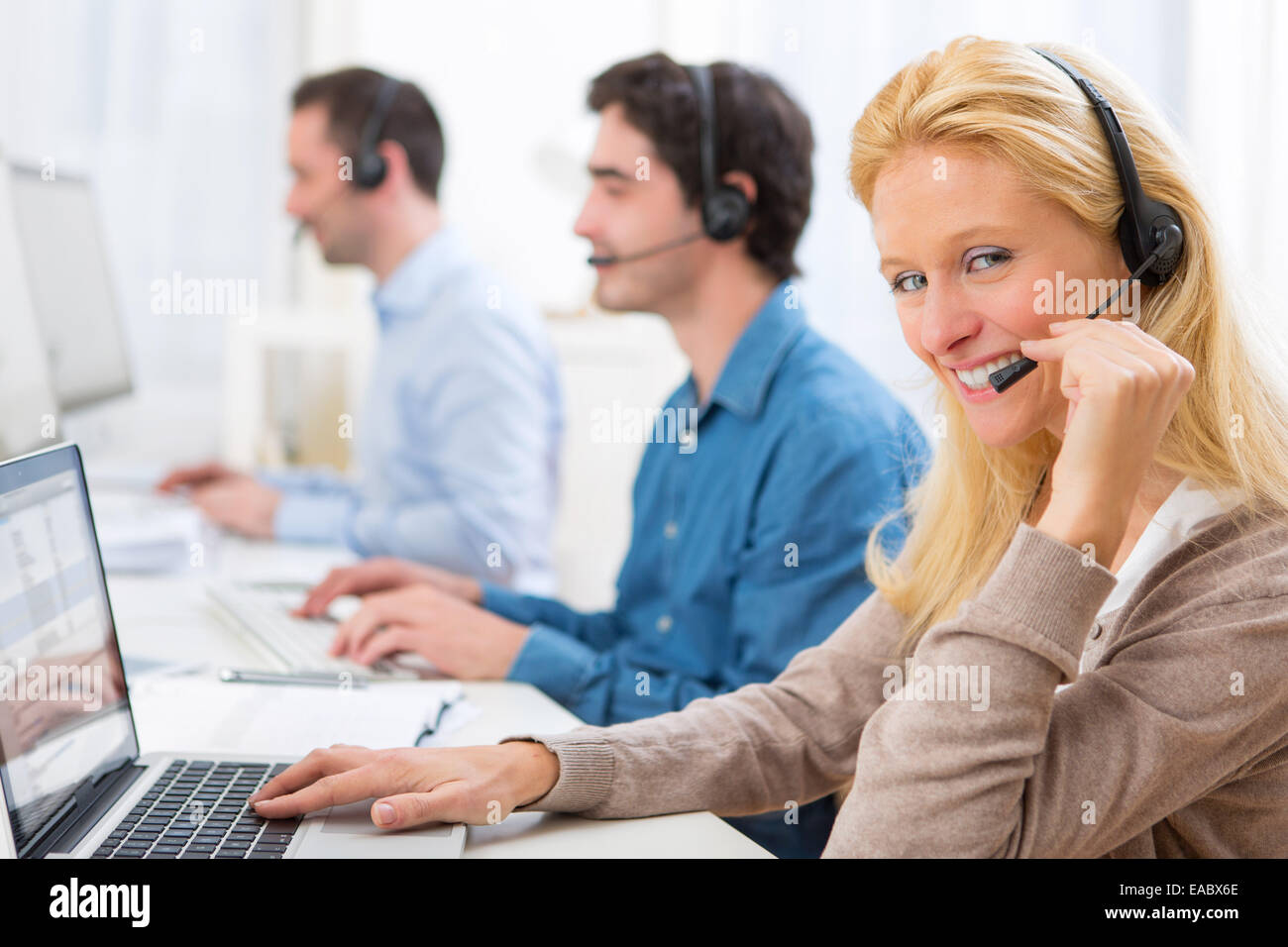 View of a Young attractive woman working in a call center Stock Photo ...