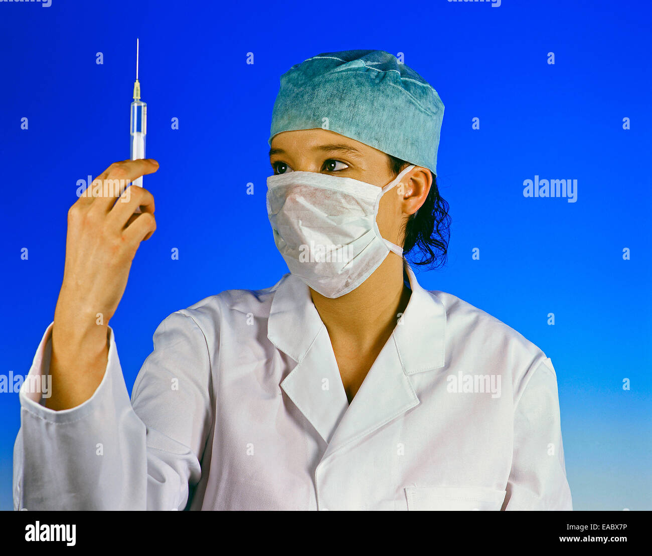 Female Doctor with Injection in her hand Stock Photo - Alamy