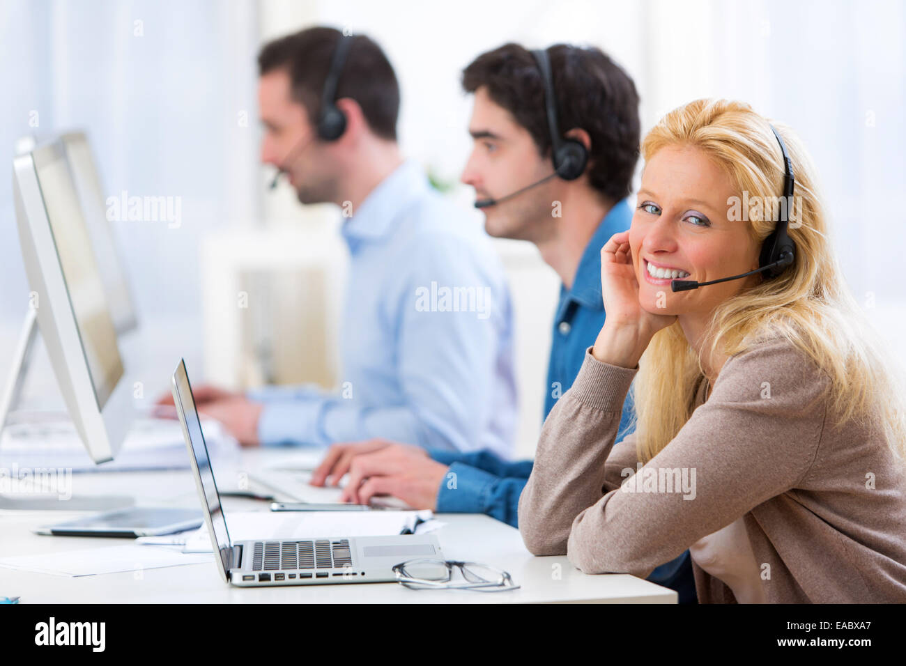 View of a Young attractive woman working in a call center Stock Photo ...