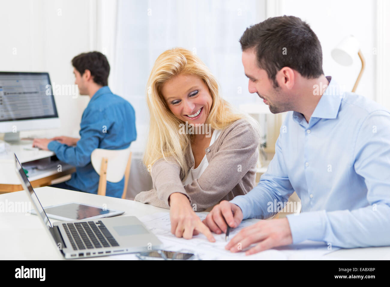 View of a Group of co workers at the office Stock Photo - Alamy