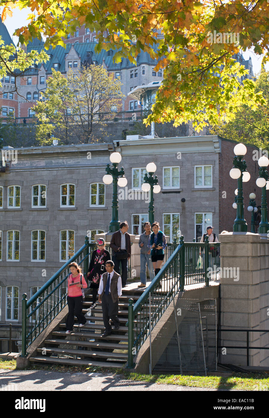 Asian tourists crossing Prescott Gate footbridge in Quebec Autumn ...