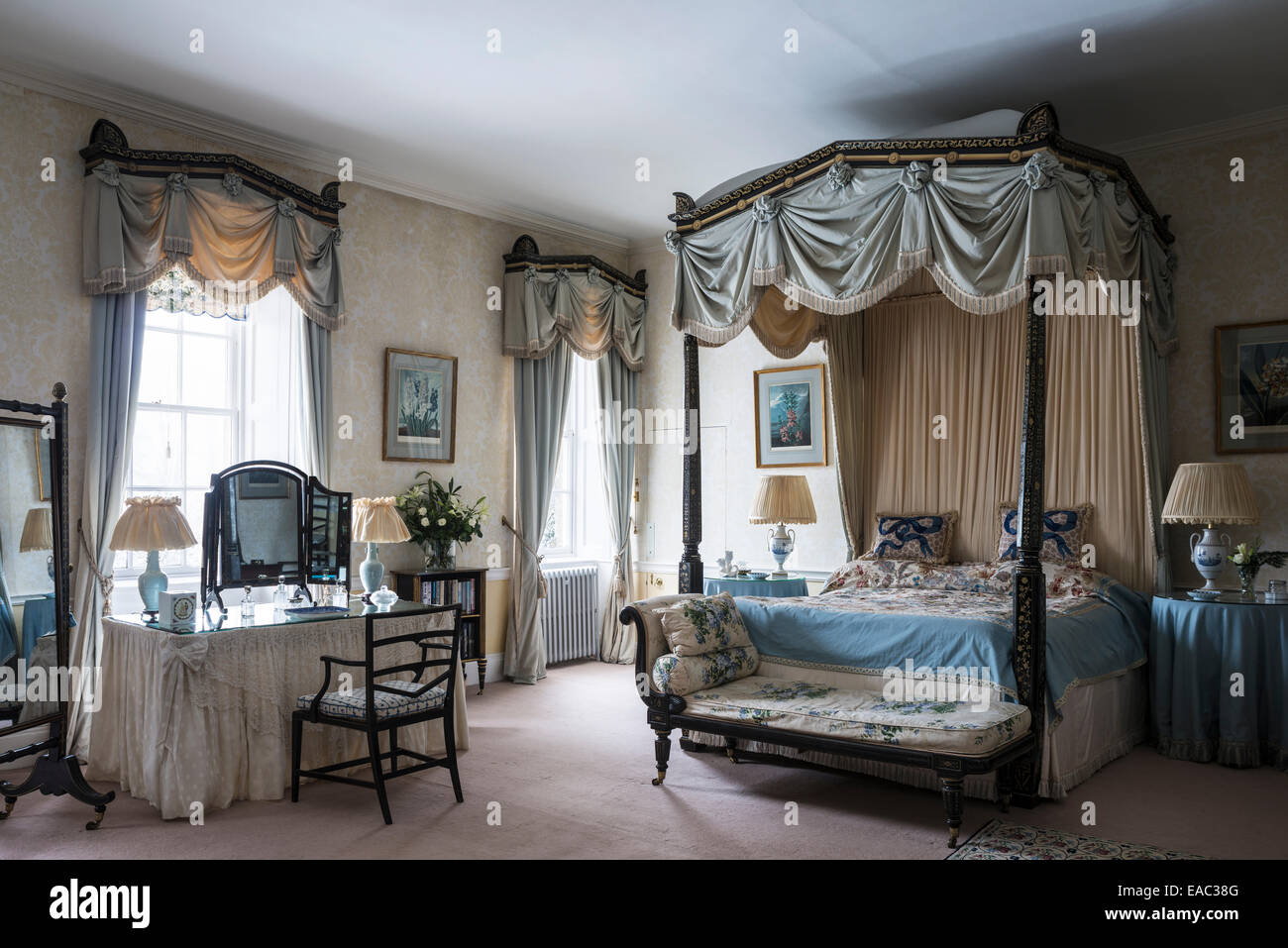 Large carved regency four poster bed in bedroom Stock Photo - Alamy