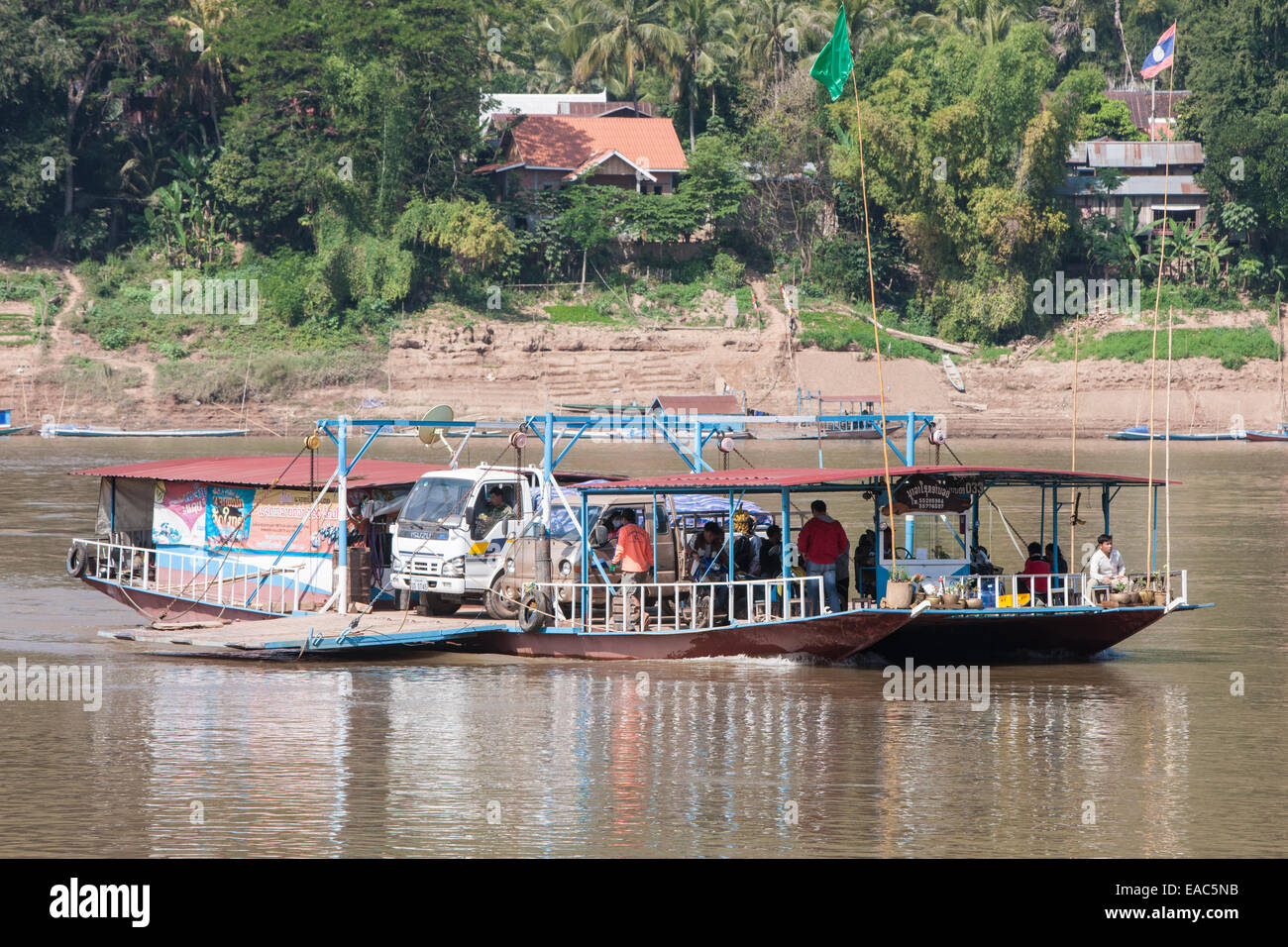 Car,truck ferry boat,shuttle craft crossing Mekong River at Luang ...
