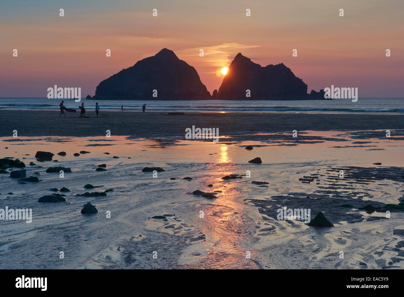 Tourists on the beach at sunset at Holywell Bay - Cornwall, England, UK ...