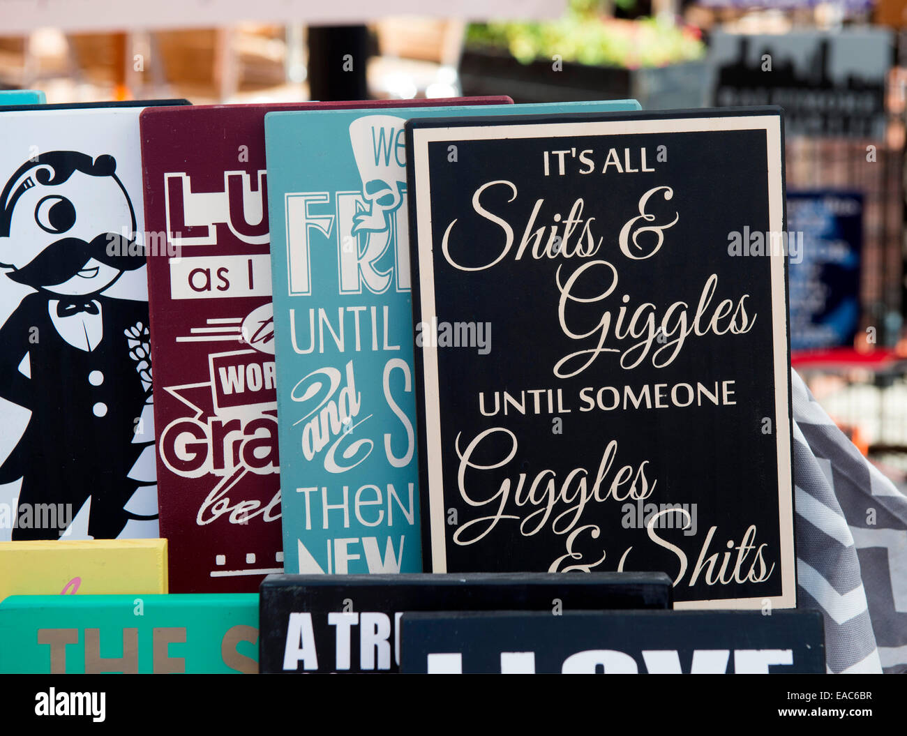 A stall of signs at the Fells Point Fun Festival, Baltimore Maryland ...
