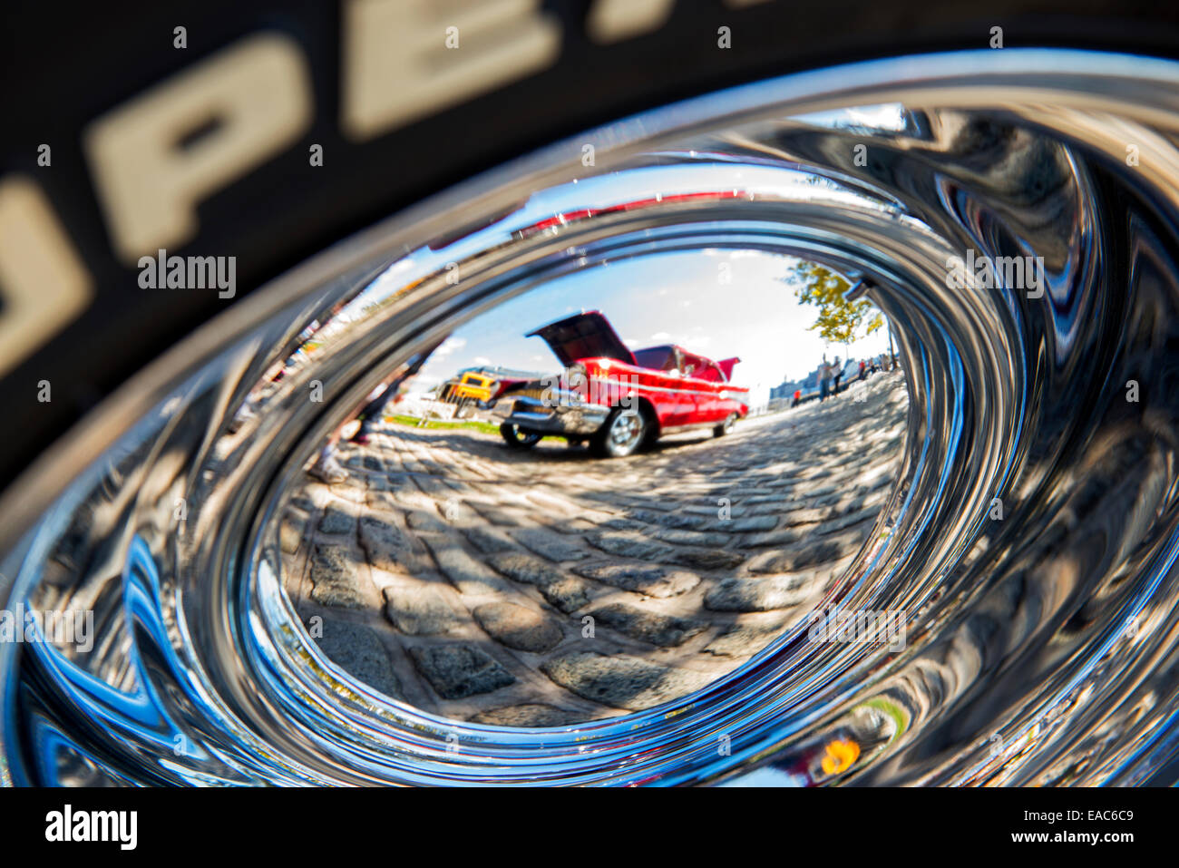 Reflection in the wheel trim of a classic car at the Fells Point Fun ...