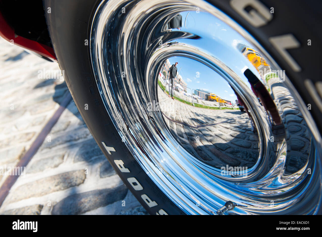 Reflection in the wheel of a classic car at the Fells Point Fun ...