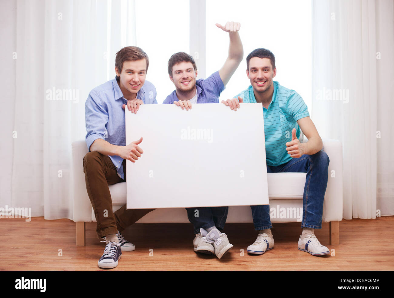Group of young friends holding blank hi-res stock photography and ...