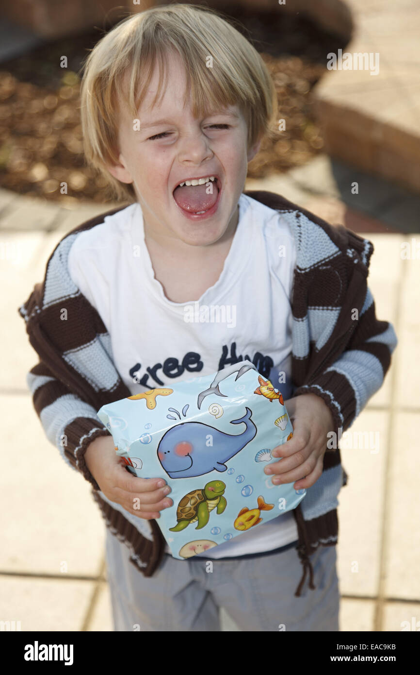 boy with present Stock Photo - Alamy