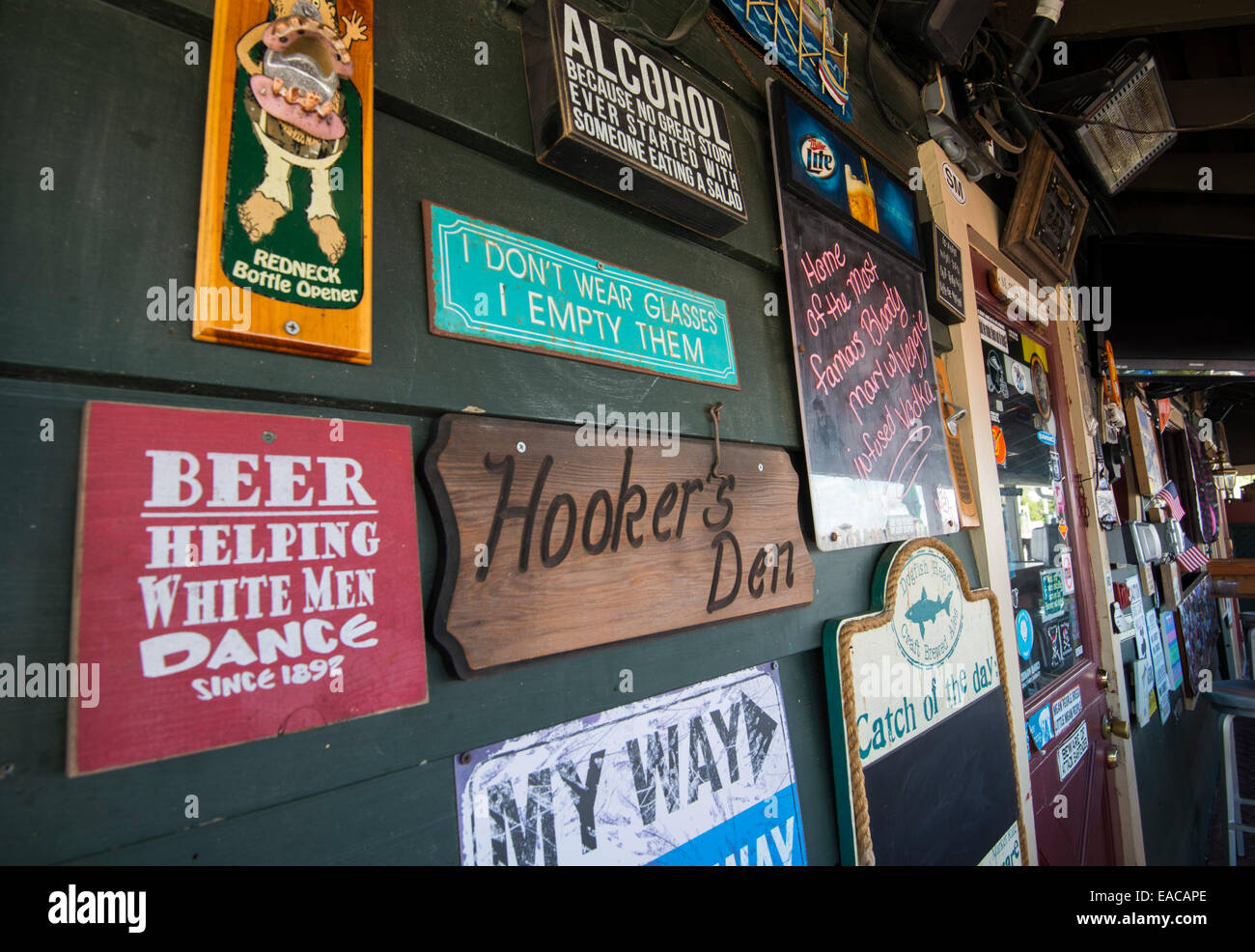 Novelty signs in a bar in Saint Michaels, Maryland USA Stock Photo - Alamy
