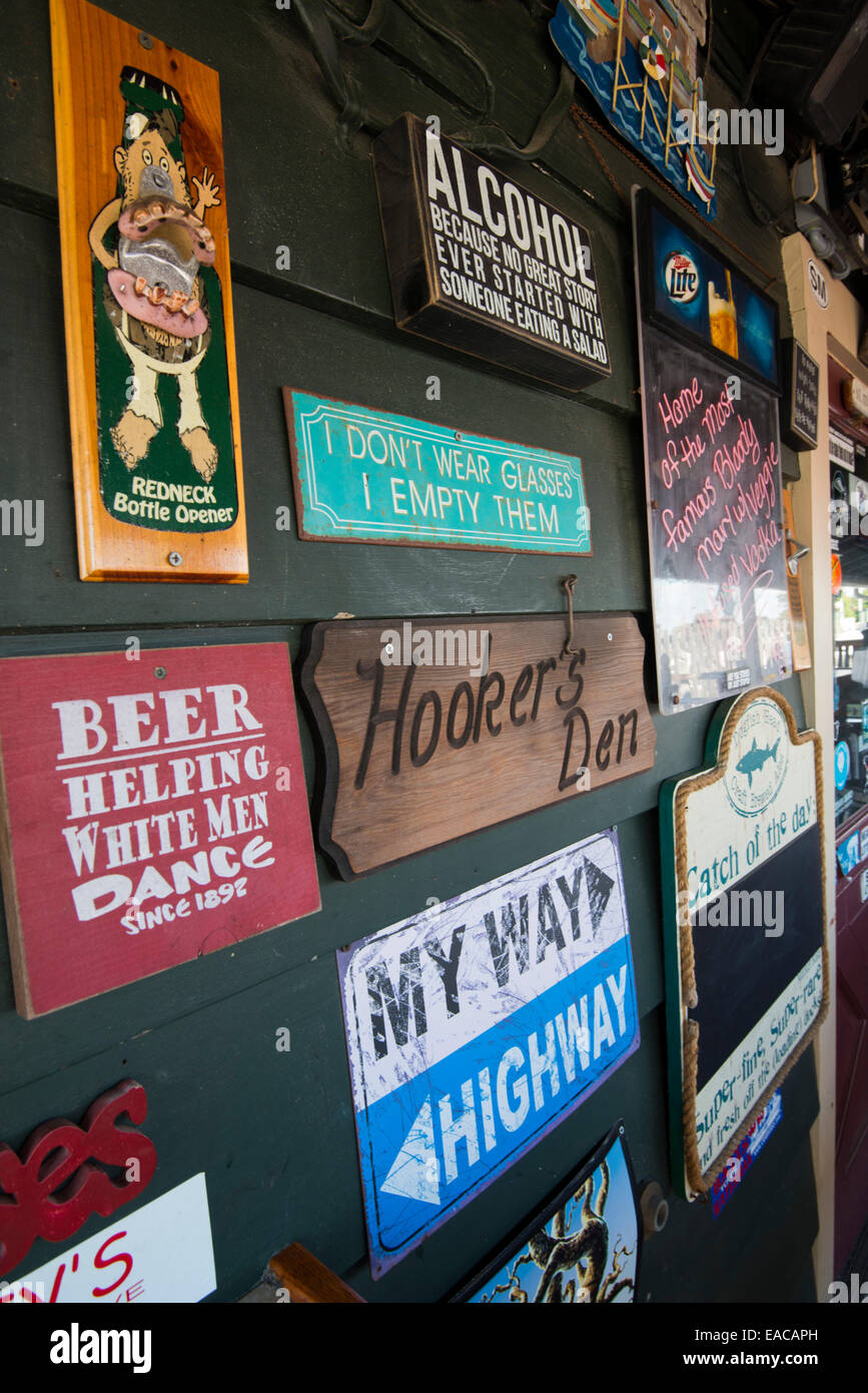 Novelty signs in a bar in Saint Michaels, Maryland USA Stock Photo - Alamy